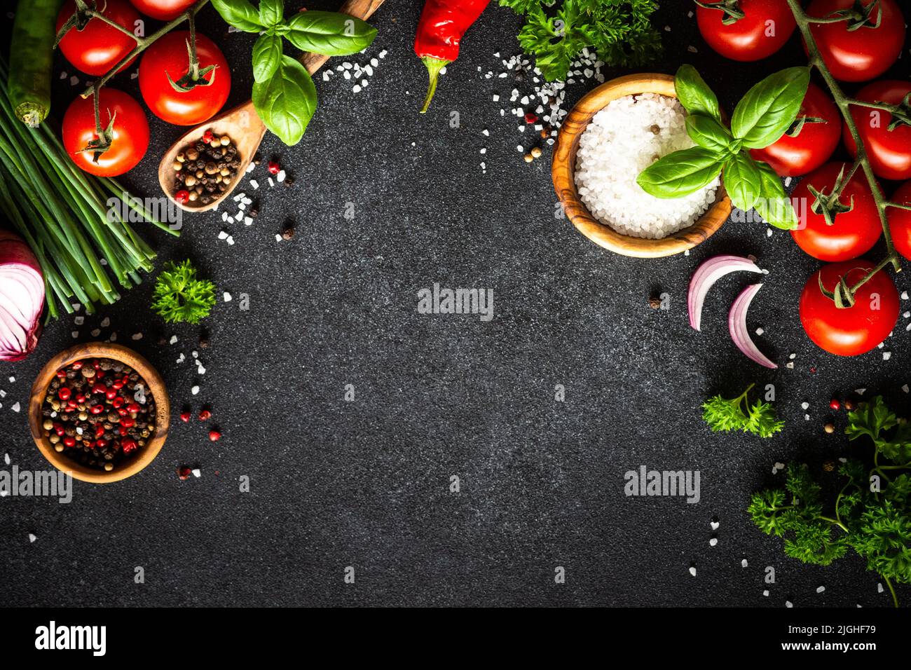 Food cooking background on black stone table Stock Photo - Alamy