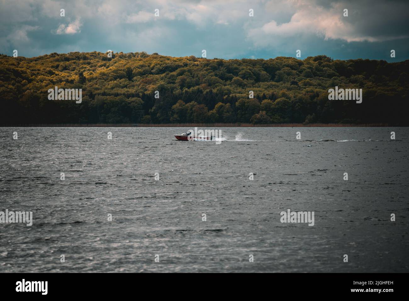 A boat is driving on a Sea Stock Photo - Alamy