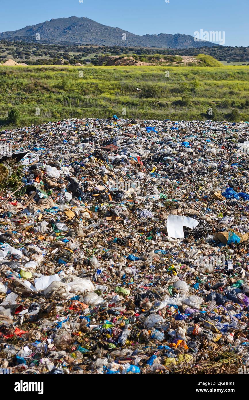 Open air garbage dump. Plastic pollution. Recycling junk. Consumerism ...