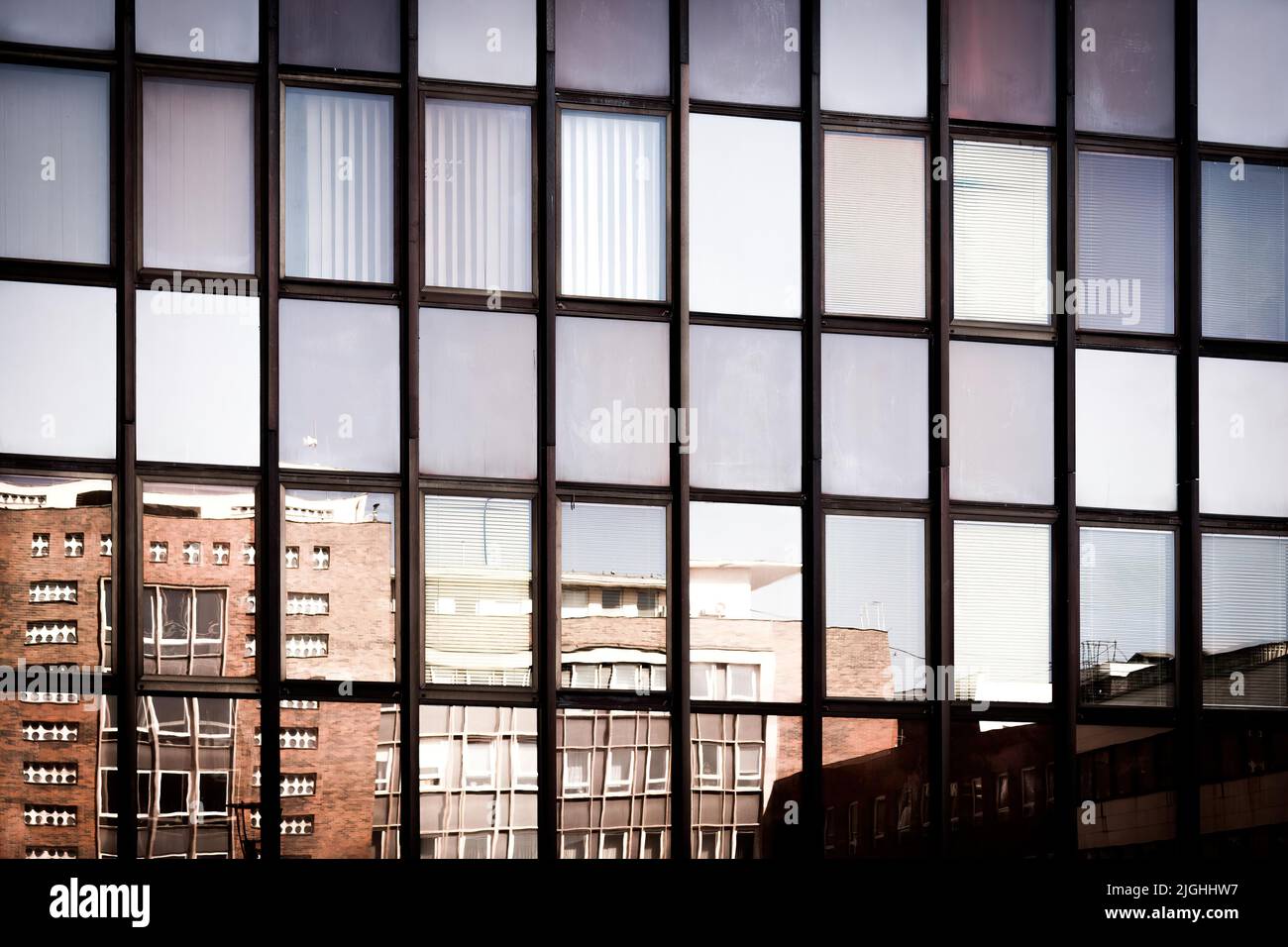 a modern house facade with windows with houses in mirror image Stock ...