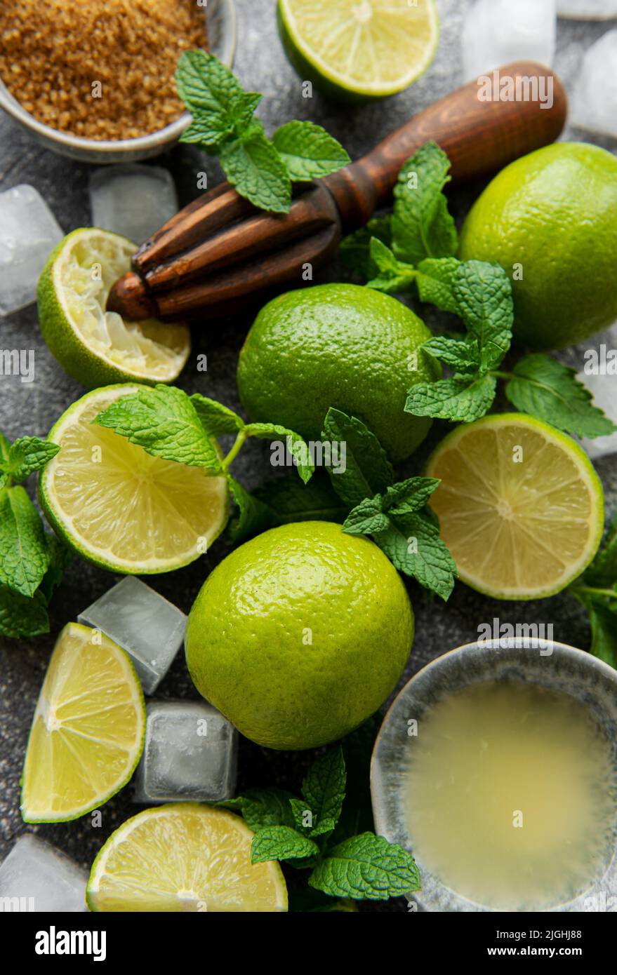 Lime, mint and ice on a dark background. The ingredients for making ...