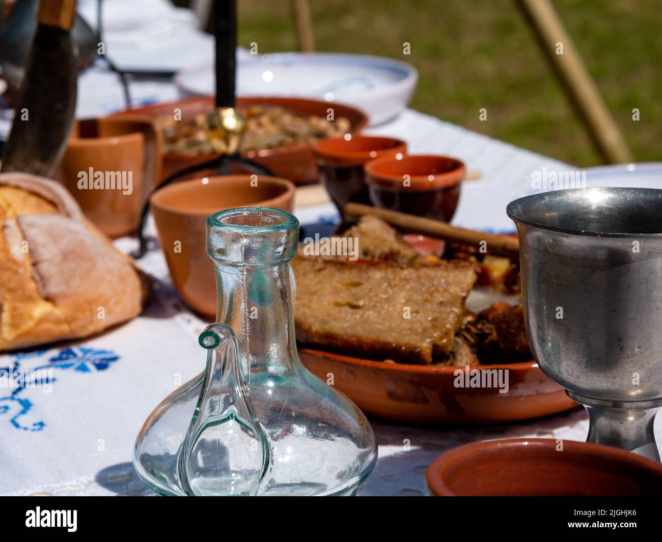 table set for outdoor medieval dining in a park during a festival Stock ...