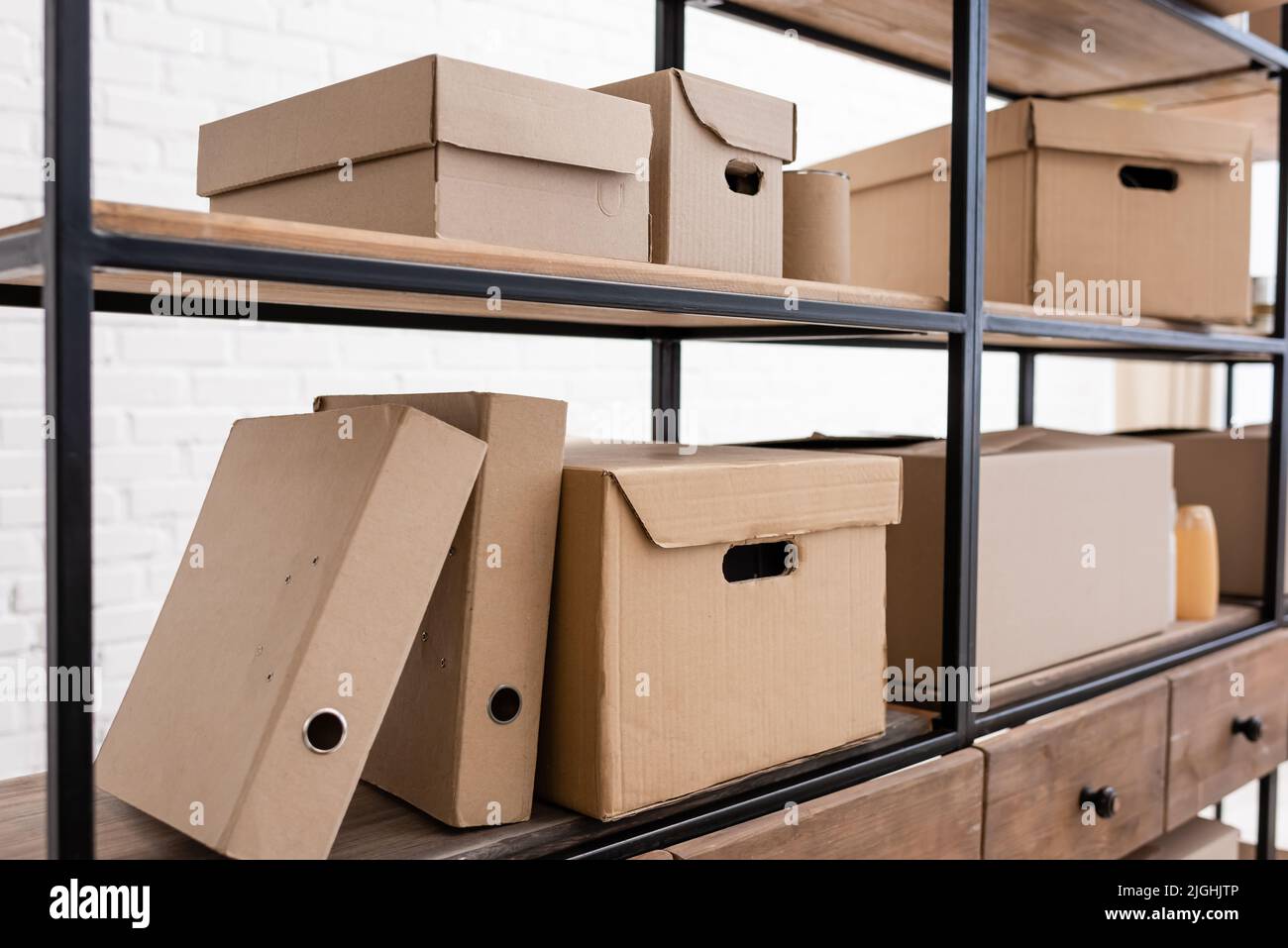 different carton packages on rack in donation center Stock Photo - Alamy