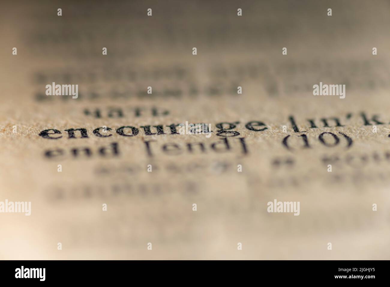 focus on encourage word printed in vintage dictionary Stock Photo - Alamy