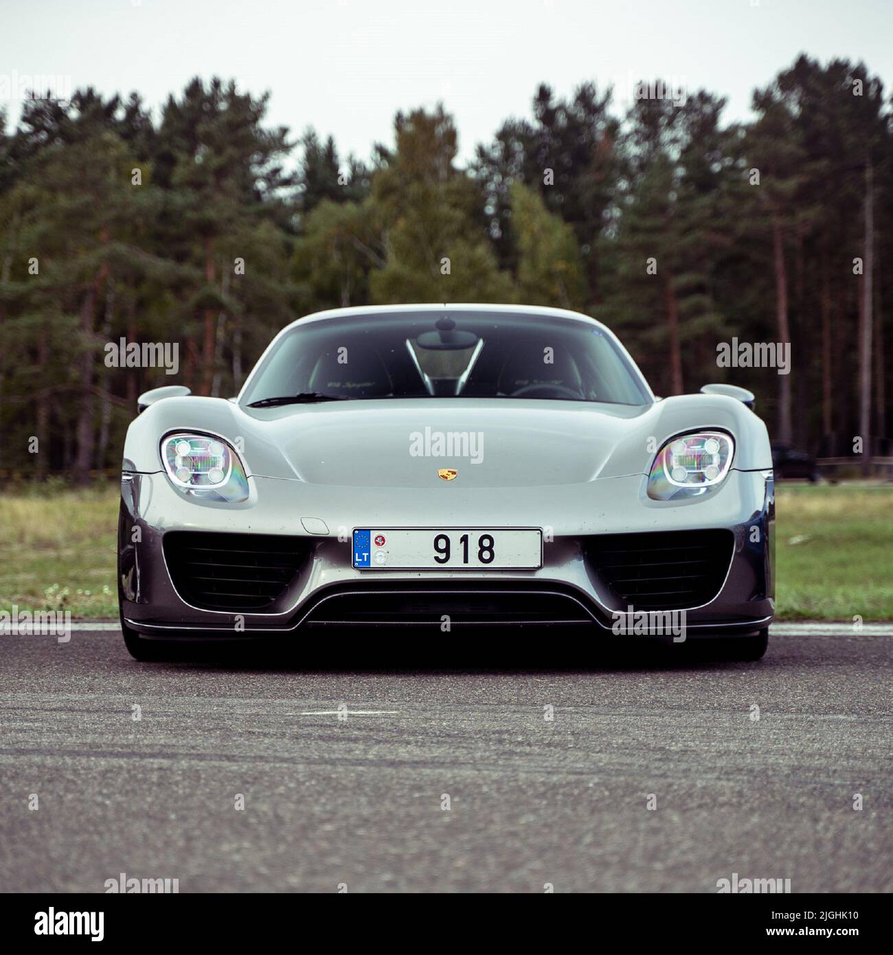 The luxury Silver Porsche 918 on the racetrack Stock Photo - Alamy