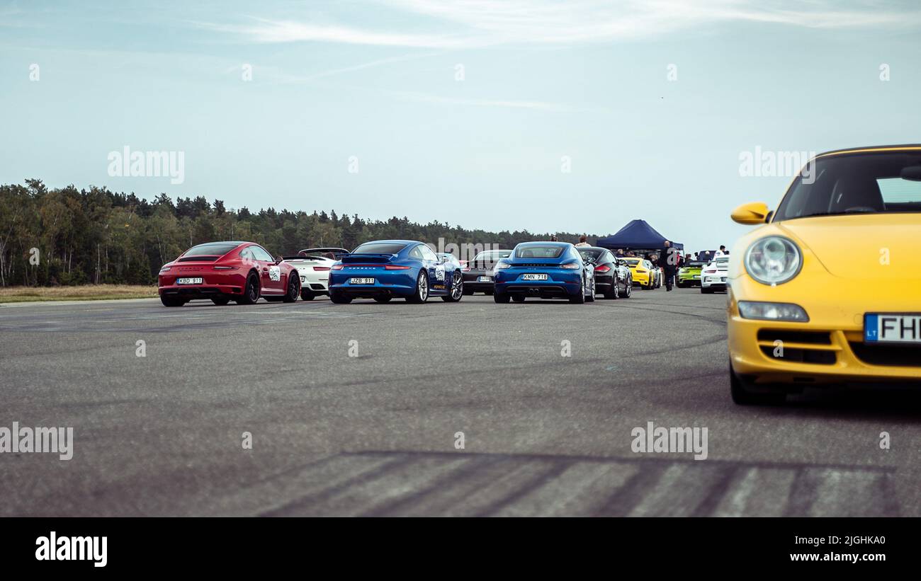 The multiple sports cars at the race event Porsche 911 Stock Photo - Alamy