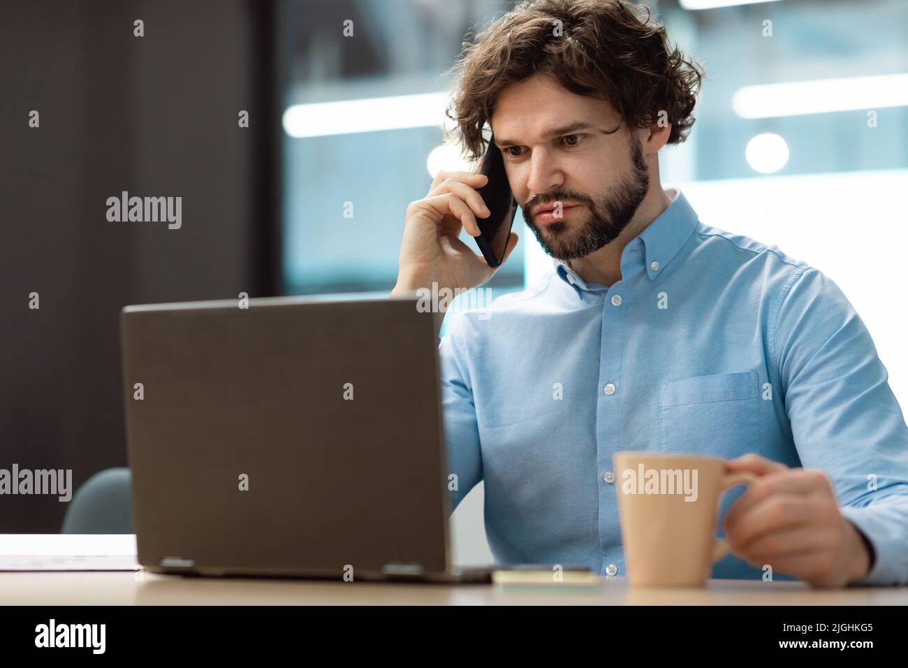 Mature businessman in formal wear talking on smartphone, enjoying ...