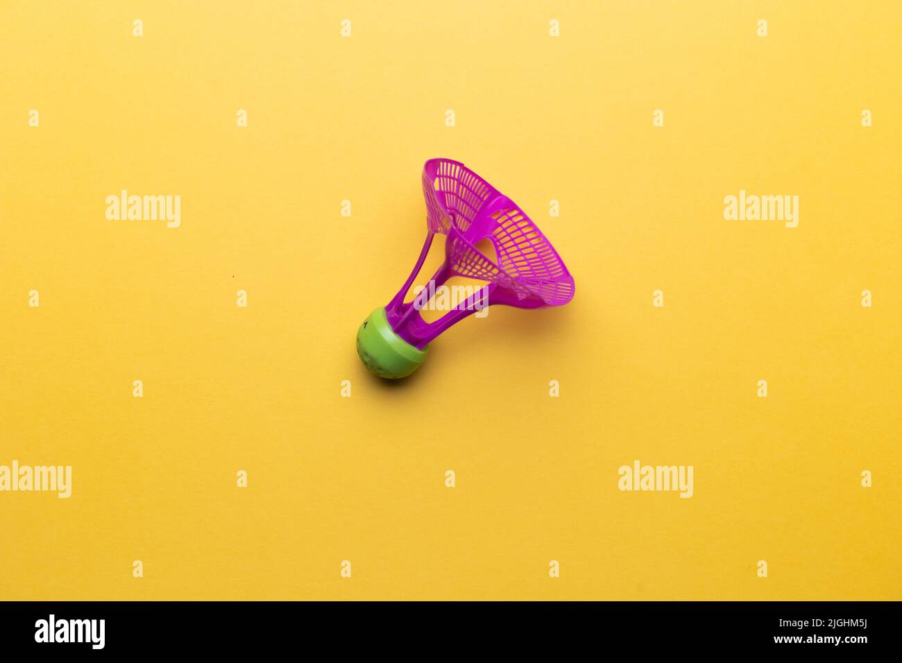 A Air Badminton Shuttlecock on a orange isolated background Stock Photo ...