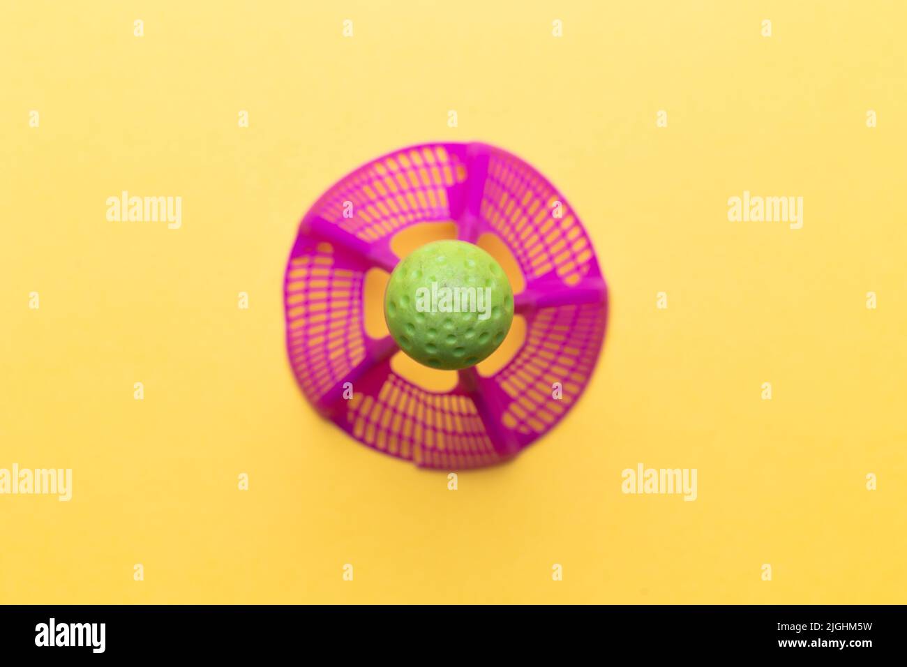 A top view of Air Badminton Shuttlecock on a orange isolated background ...