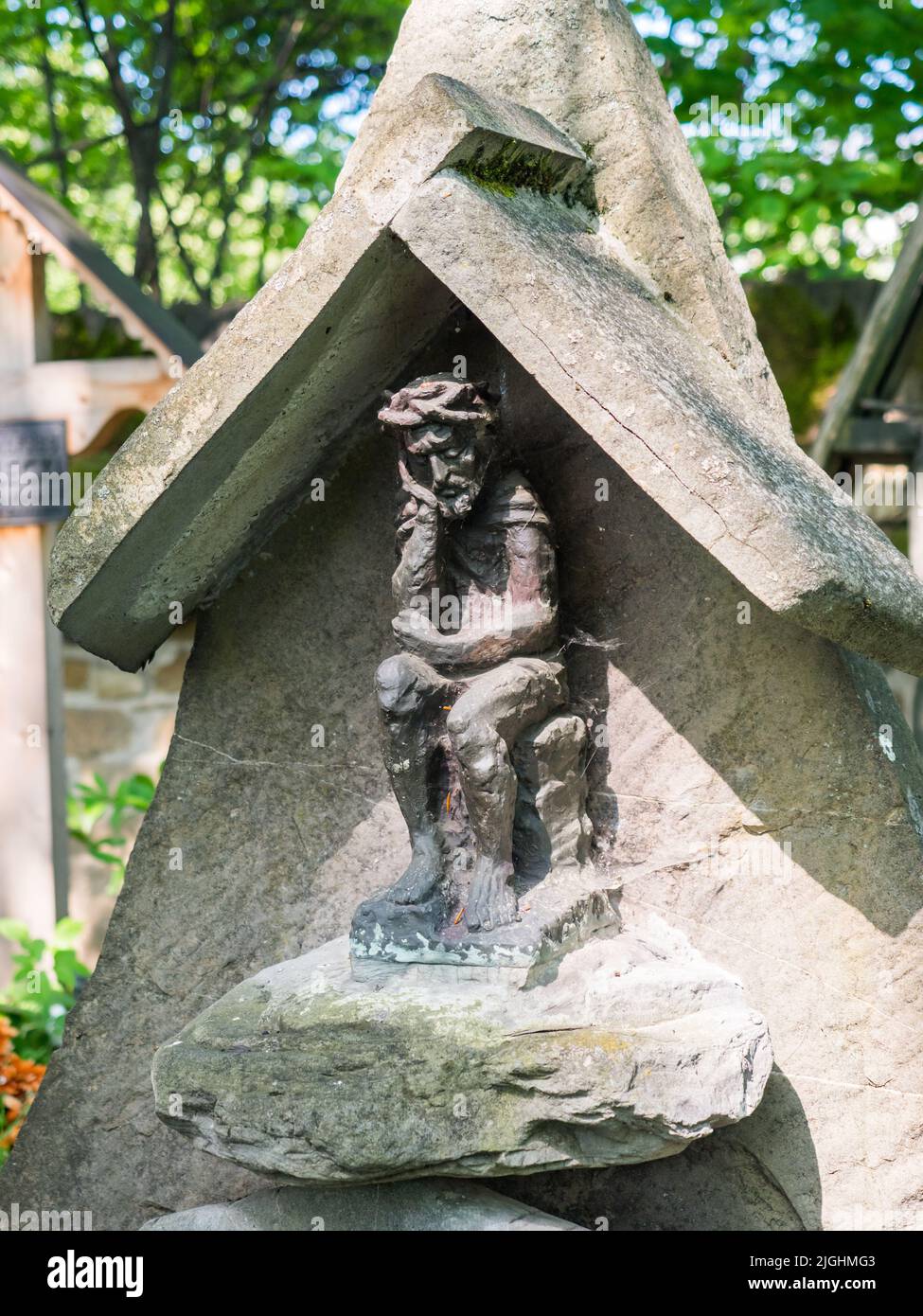 Zakopane, Poland - June 4, 2019: Figure of Jesus on highlander grave on old, historic cemetery ...