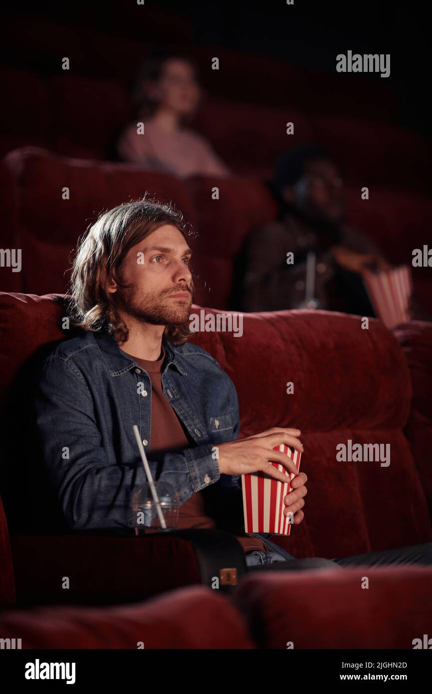 Man in cinema seat hi-res stock photography and images - Alamy