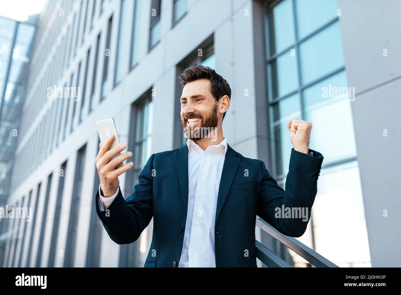 Happy glad excited european millennial bearded businessman in suit ...