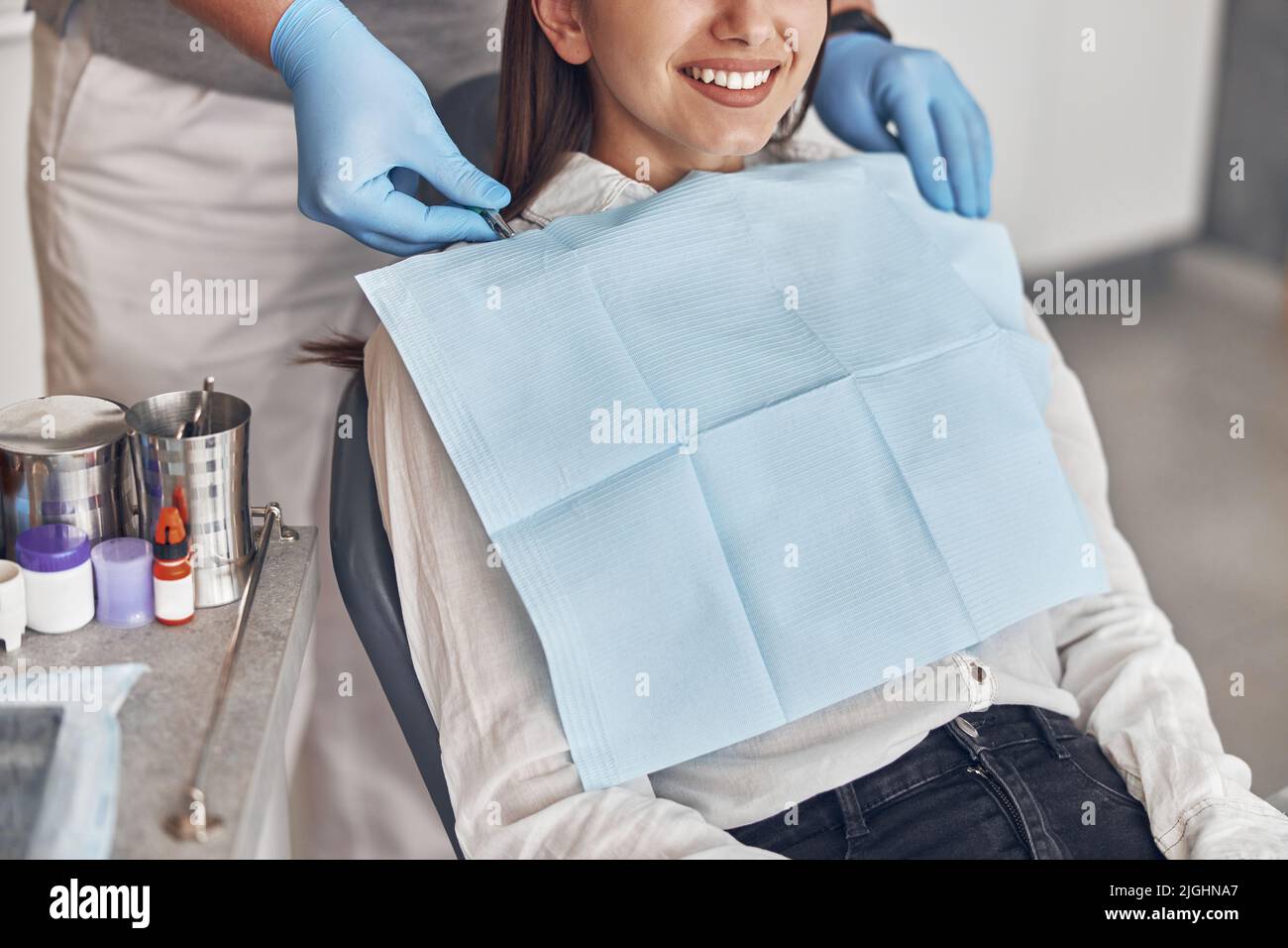 Confident male doctor is preparing young woman to dental survey Stock ...
