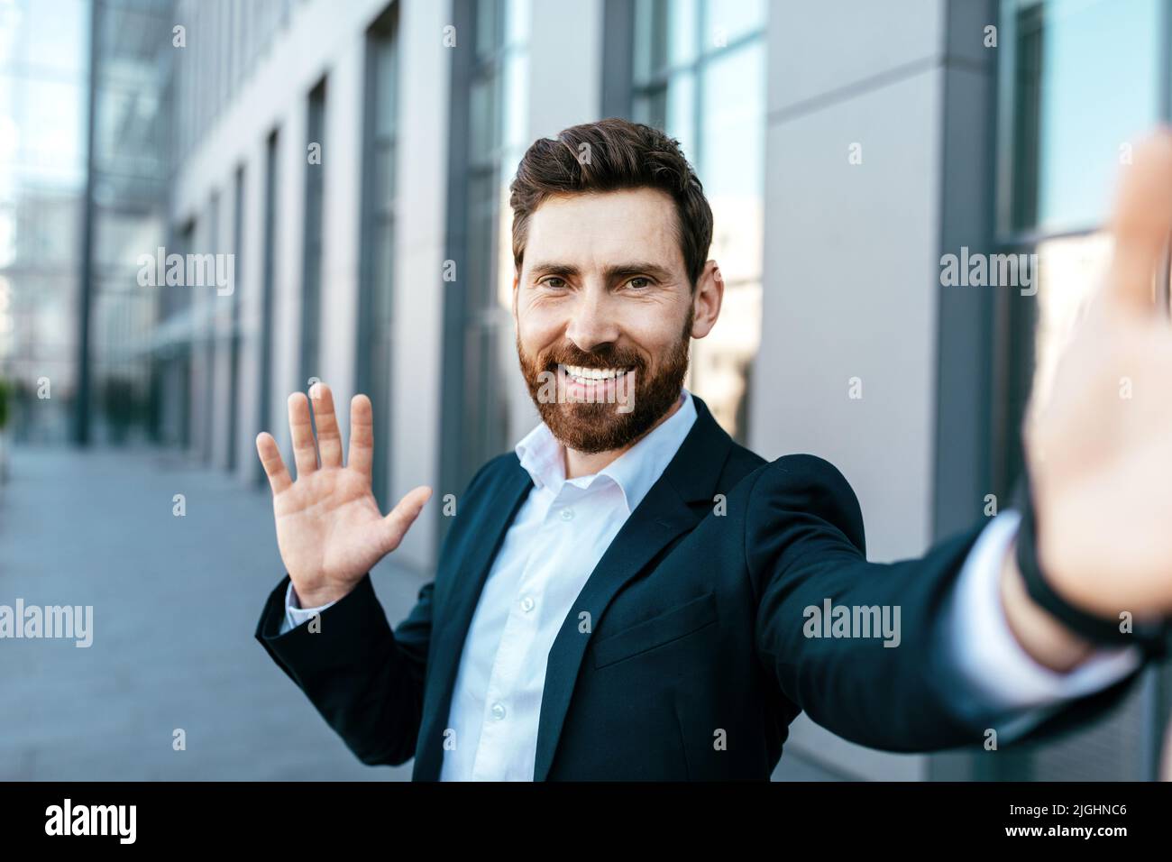 Happy confident handsome european millennial bearded businessman takes ...