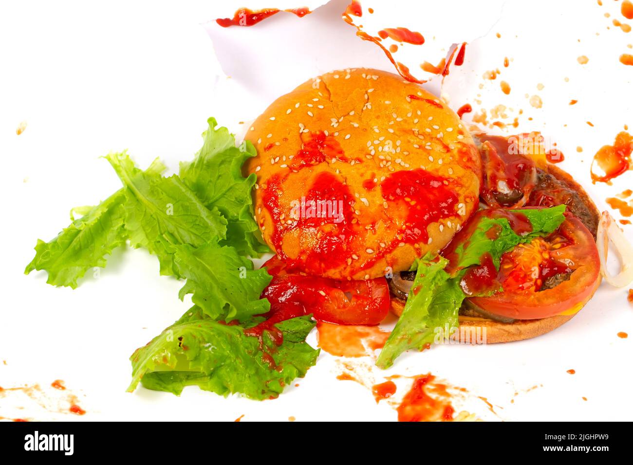 Broken hamburger against the background of splashed ketchup.Creative ...