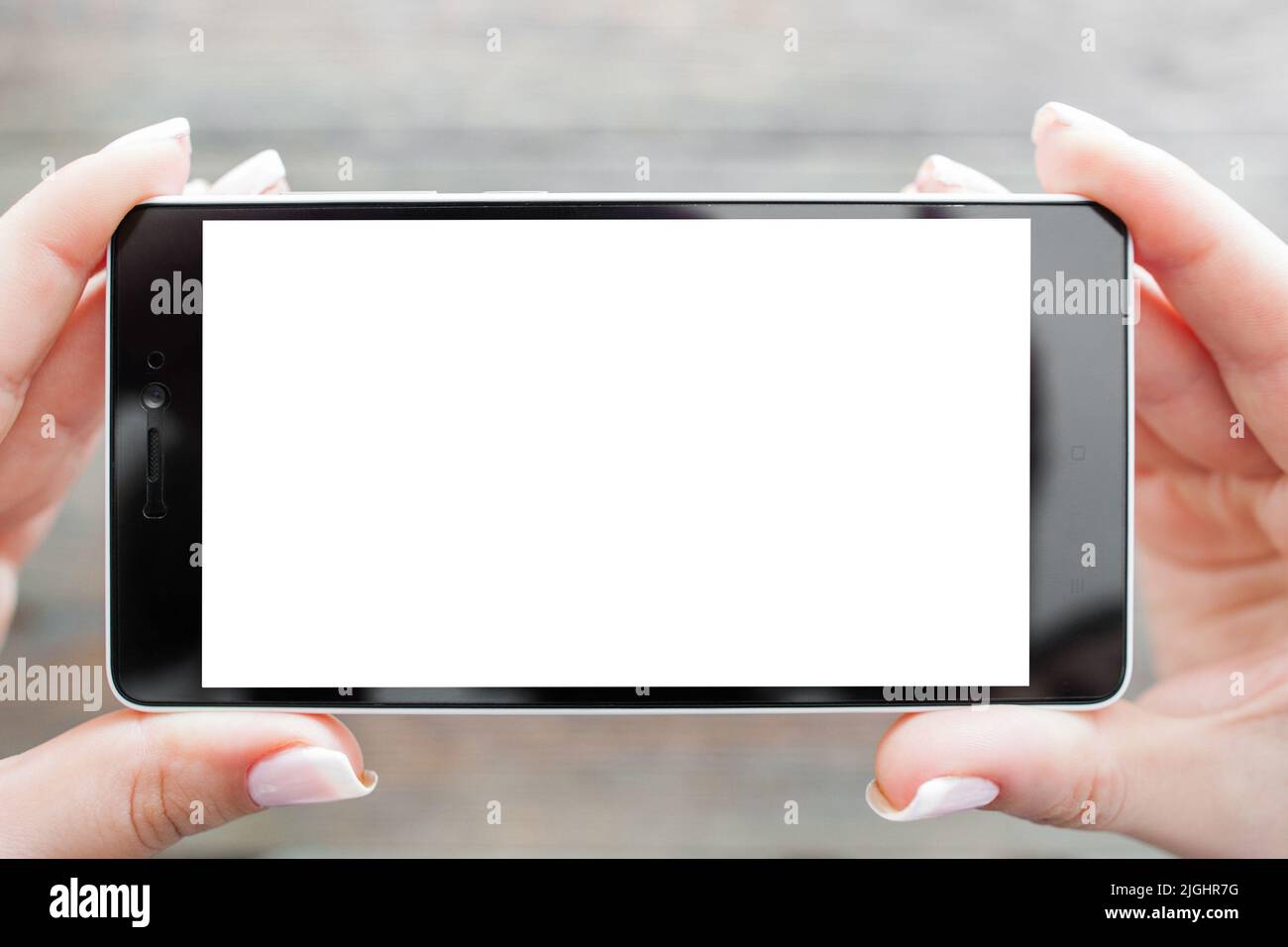 Hand holding mobile phone with blank screen Stock Photo - Alamy