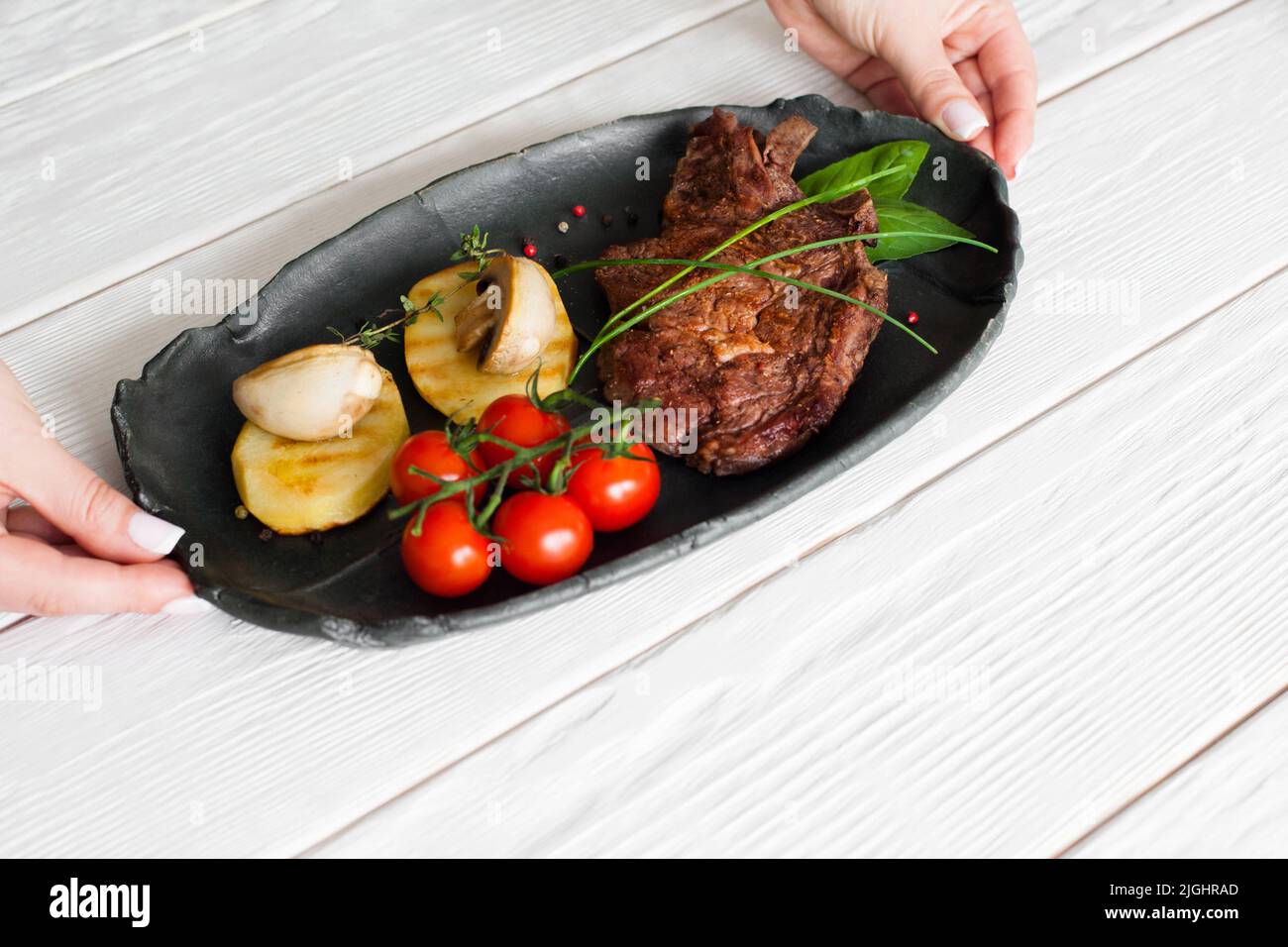 Menu hands table restaurant hi-res stock photography and images - Alamy