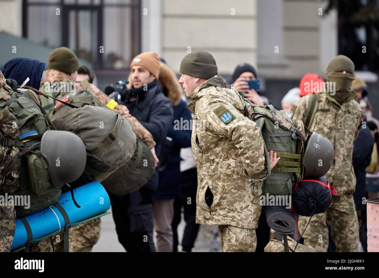 Ukrainian soldiers leave to join war effort. Ukrainian soldiers wearing ...
