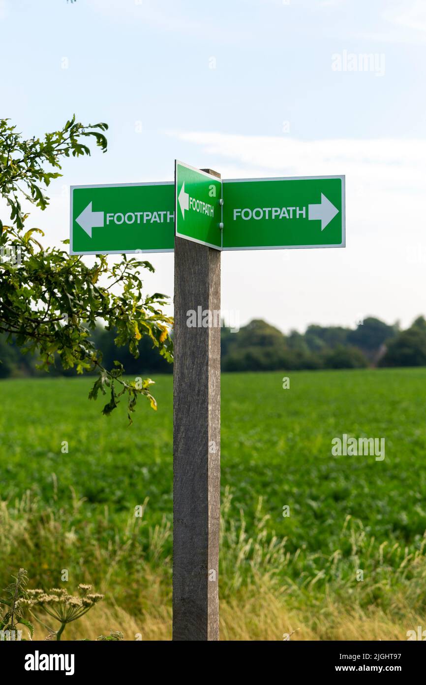 Footpath sign with direction arrows in three directions, Sutton ...