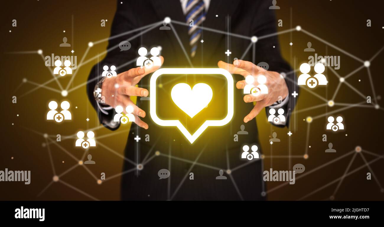 Hand holding social media icons Stock Photo - Alamy