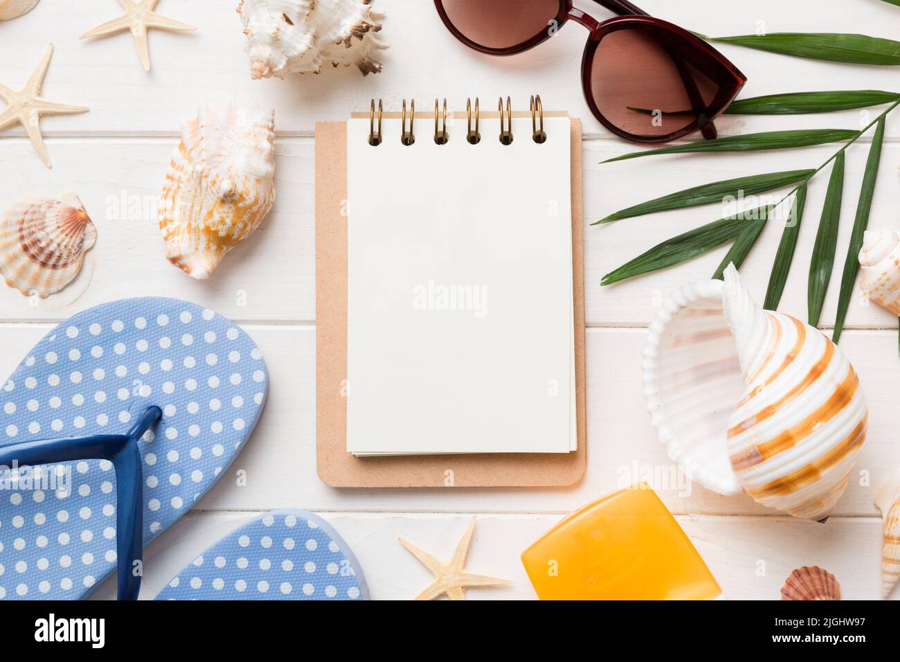 Blank writing book with summer beach accessories on background, copy ...