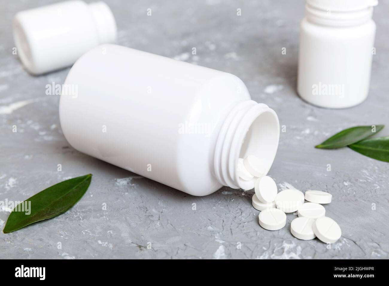 different drugs and health supplement pills poured from a medicine ...