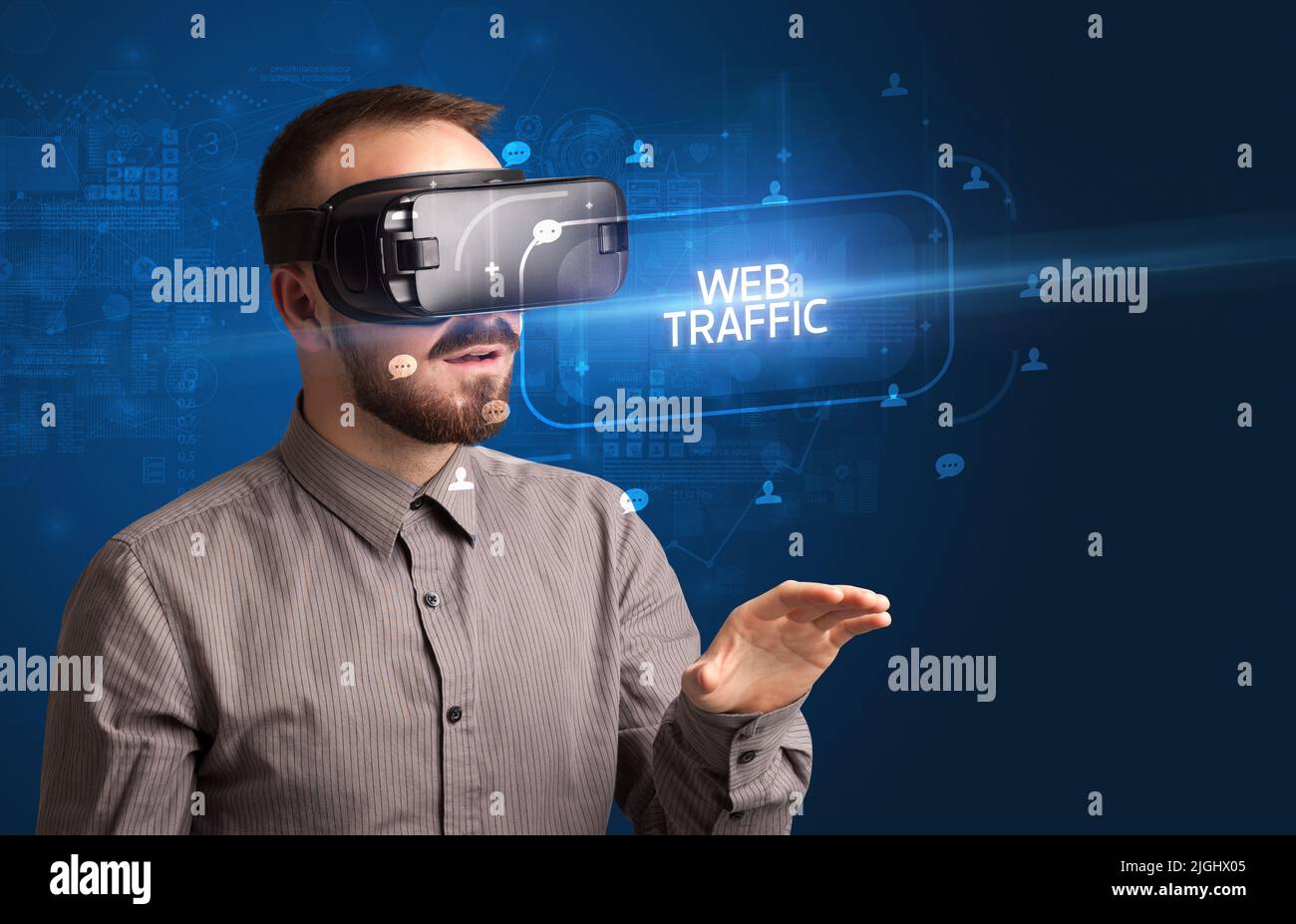 Businessman looking through Virtual Reality glasses, social media ...