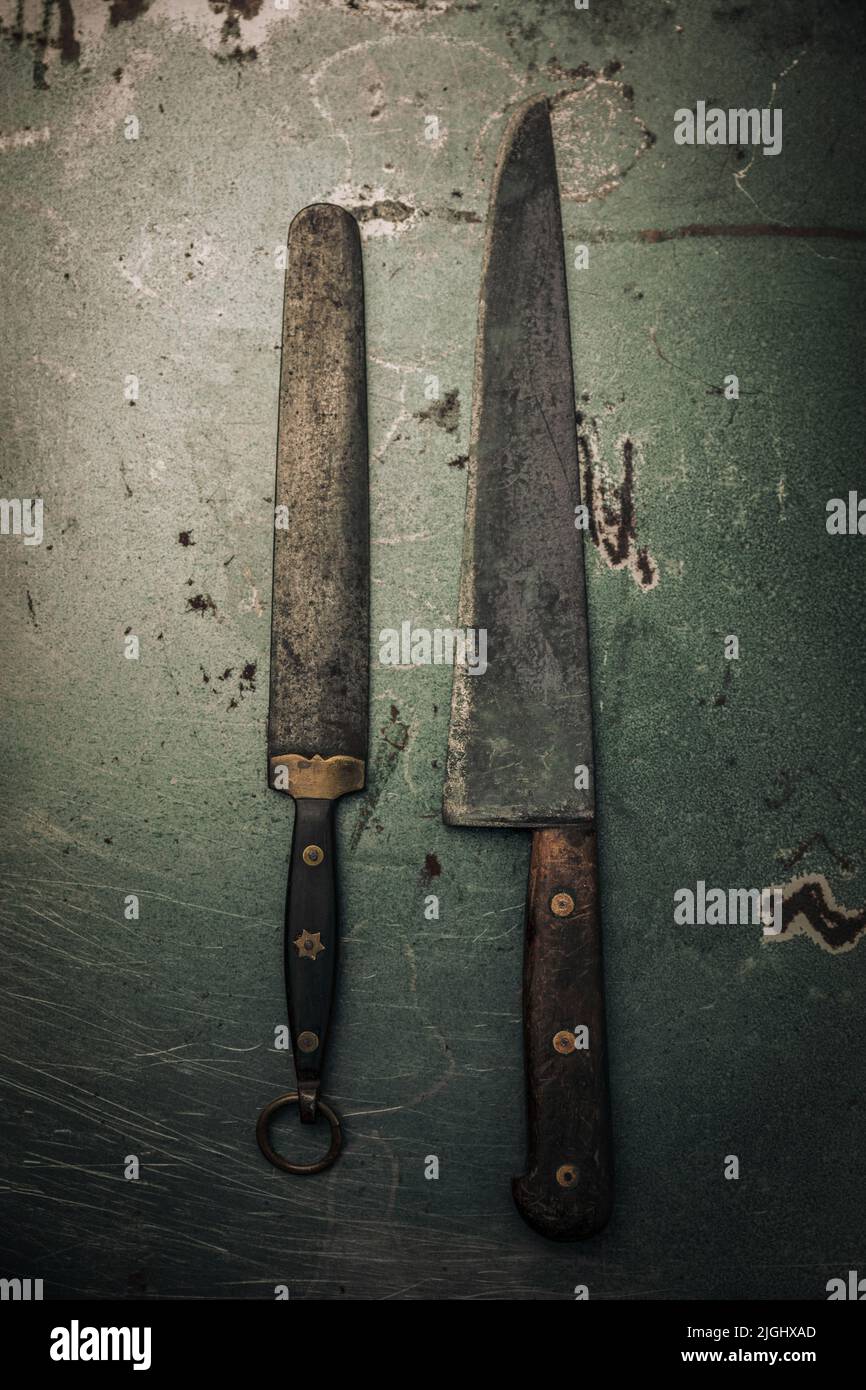 vintage collection of old rusty kitchen knife and knife sharpener on ...