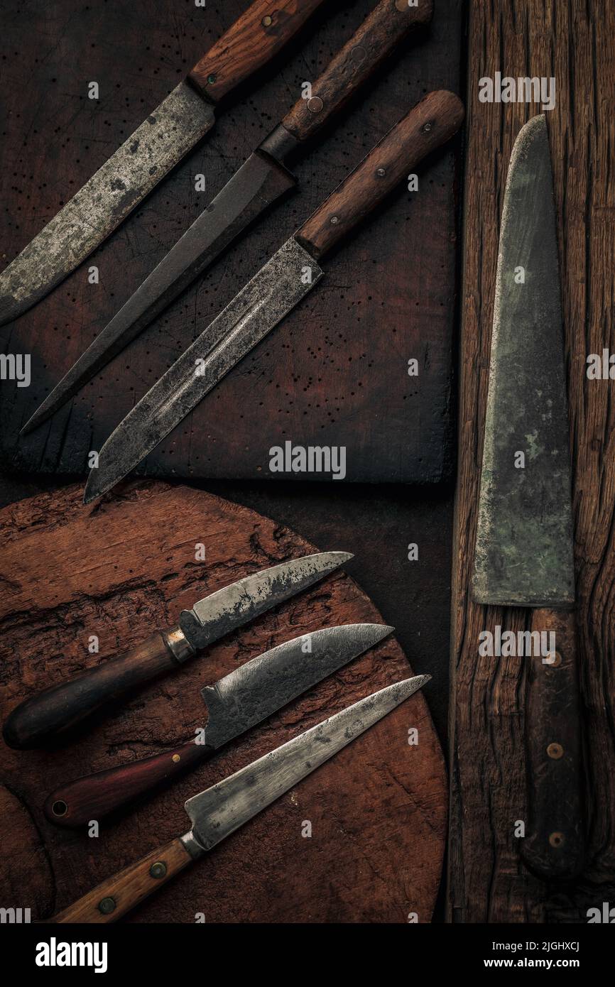 cooking concept picture of collection of rustic knives with carbon ...