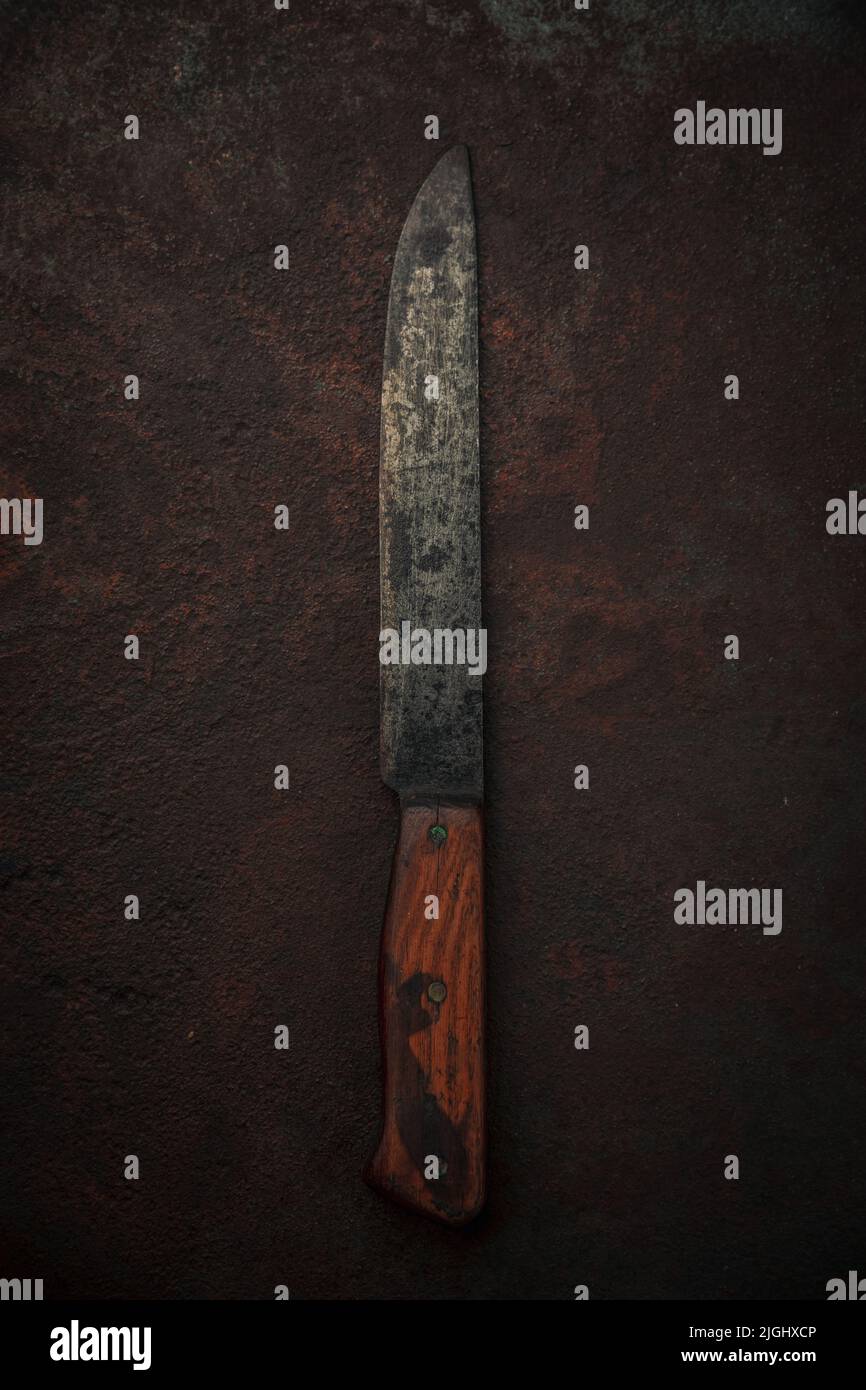 rustic old kitchen knife with decayed carbon steel blade on rusty ...