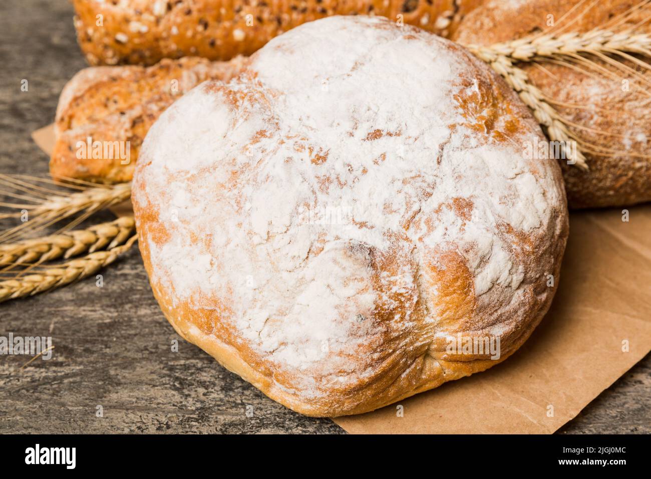 Homemade natural breads. Different kinds of fresh bread as background ...
