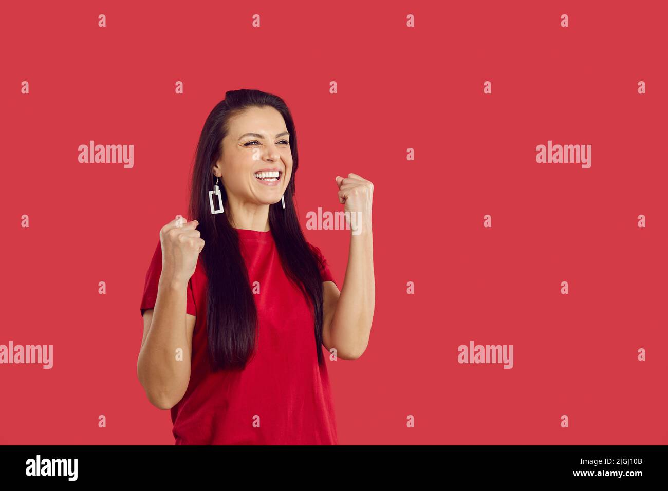 Smiling woman make yes gesture celebrate success Stock Photo - Alamy
