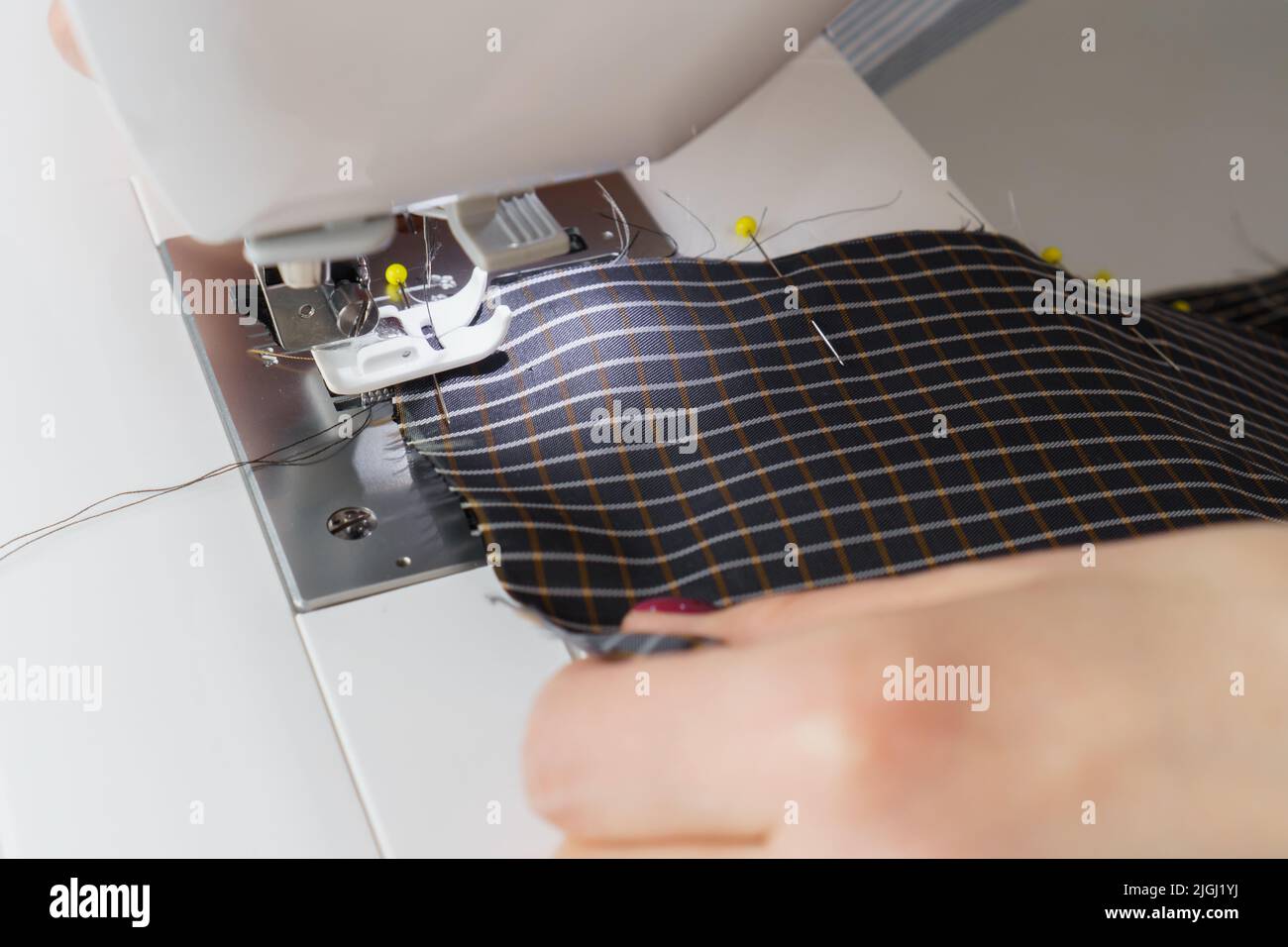 Woman dressmaker works hands hi-res stock photography and images - Alamy