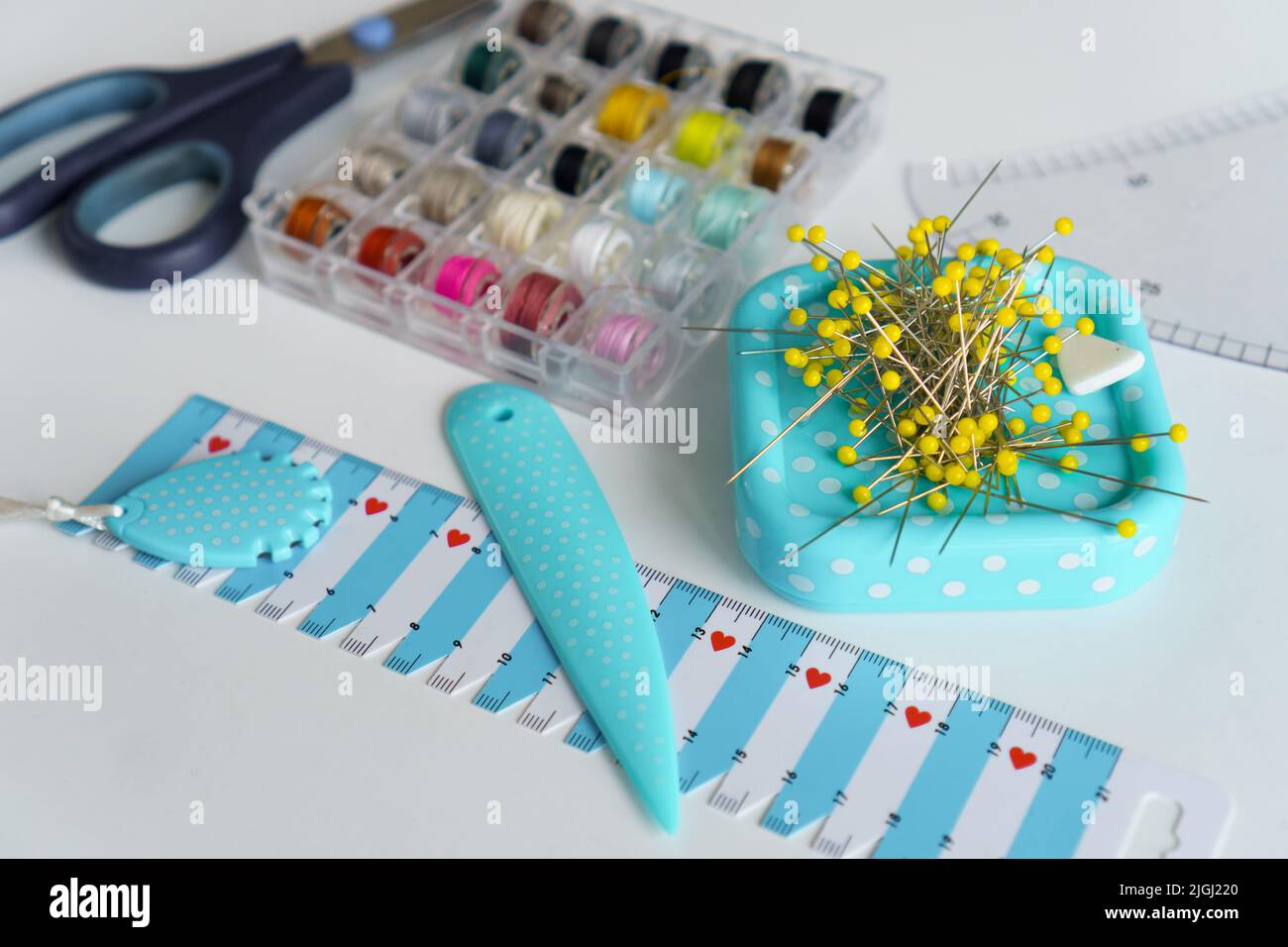 Sewing items and seamstress tools. Tailoring scissors, measuring tape ...