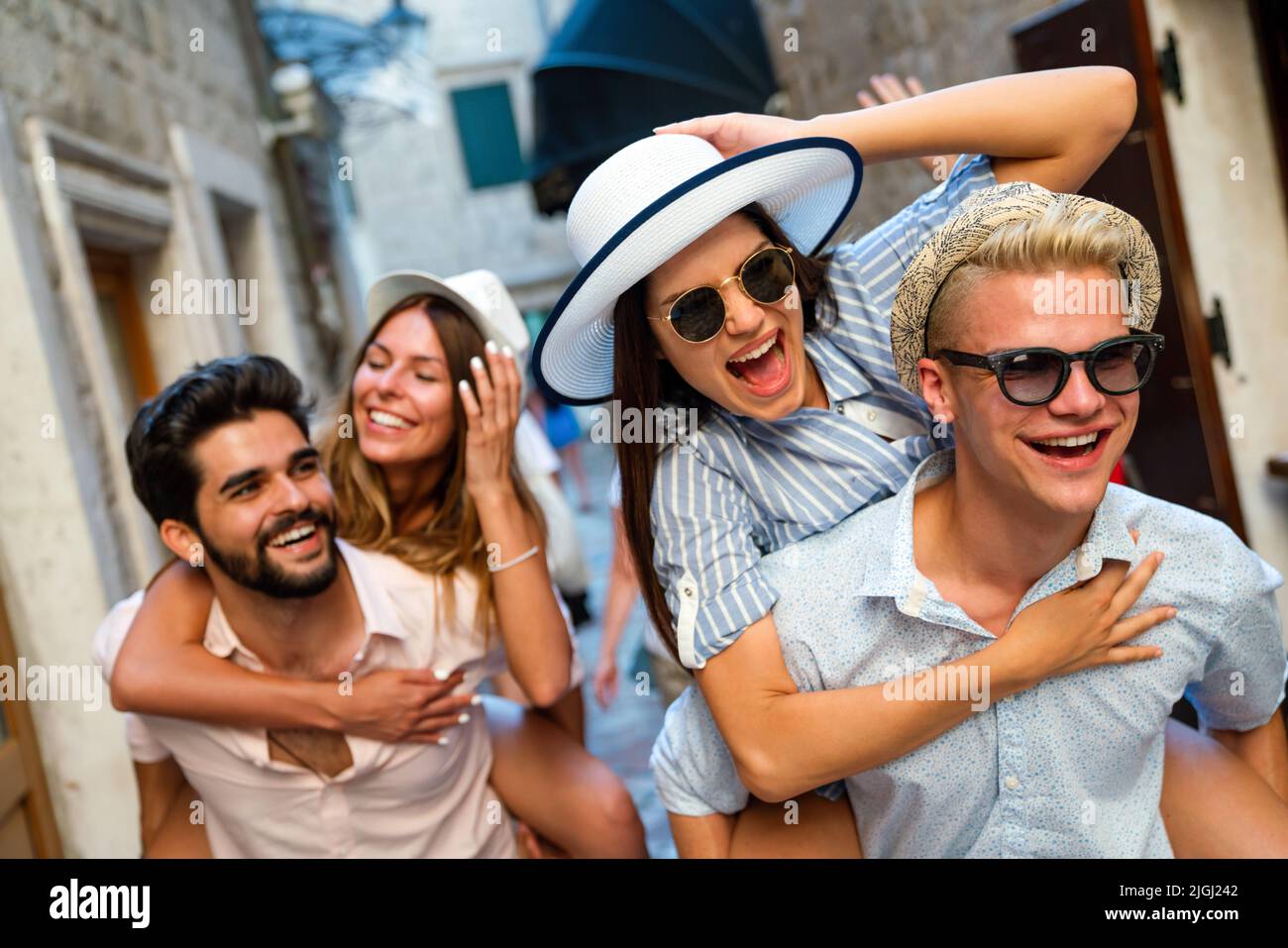 Group of happy friends enjoying travel and summer vacation together ...