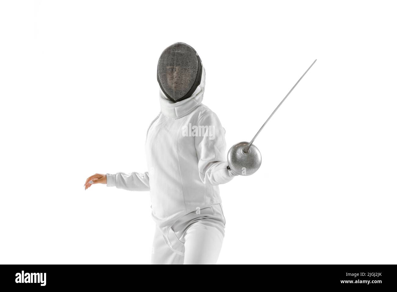 One sportsman, female fencer in white fencing costume in action, motion ...