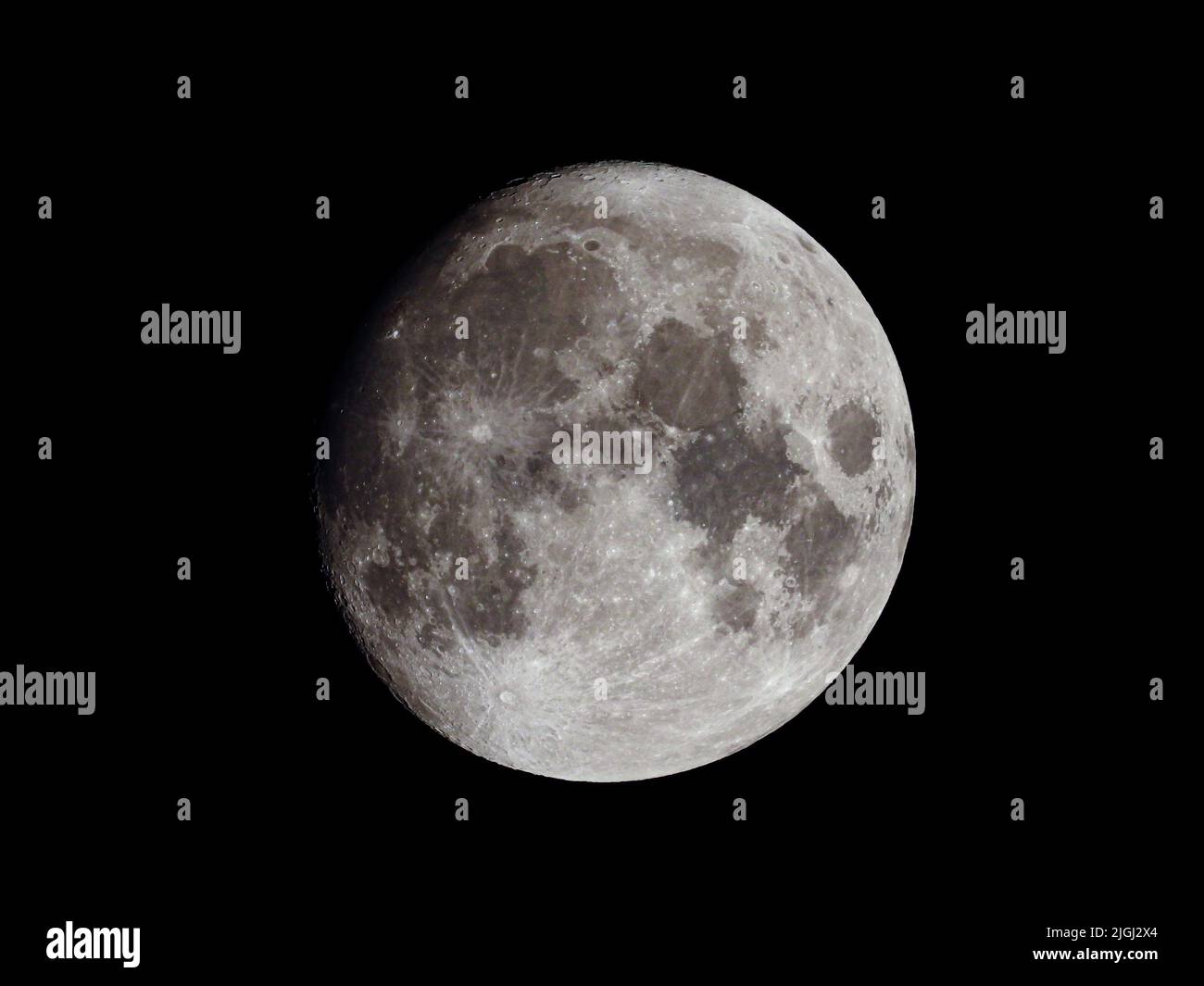 A zoomed-in view of the moon in the dark night sky Stock Photo - Alamy