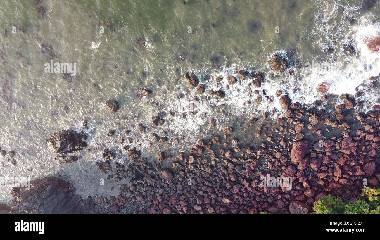 A scenic aerial view of rocks on the seashore Stock Photo - Alamy