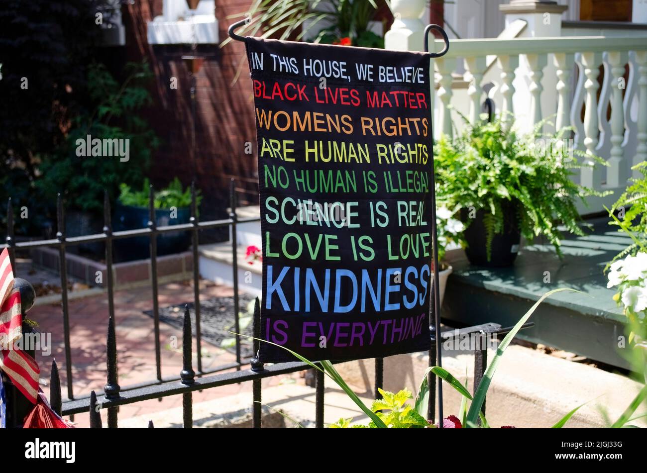 An activism sign promoting equal rights on a house garden fence Stock ...