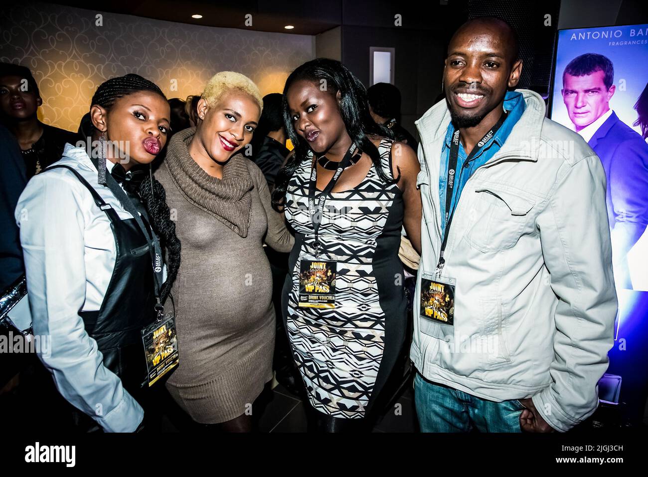 A group of diverse people at a cocktail party in Johannesburg, South ...