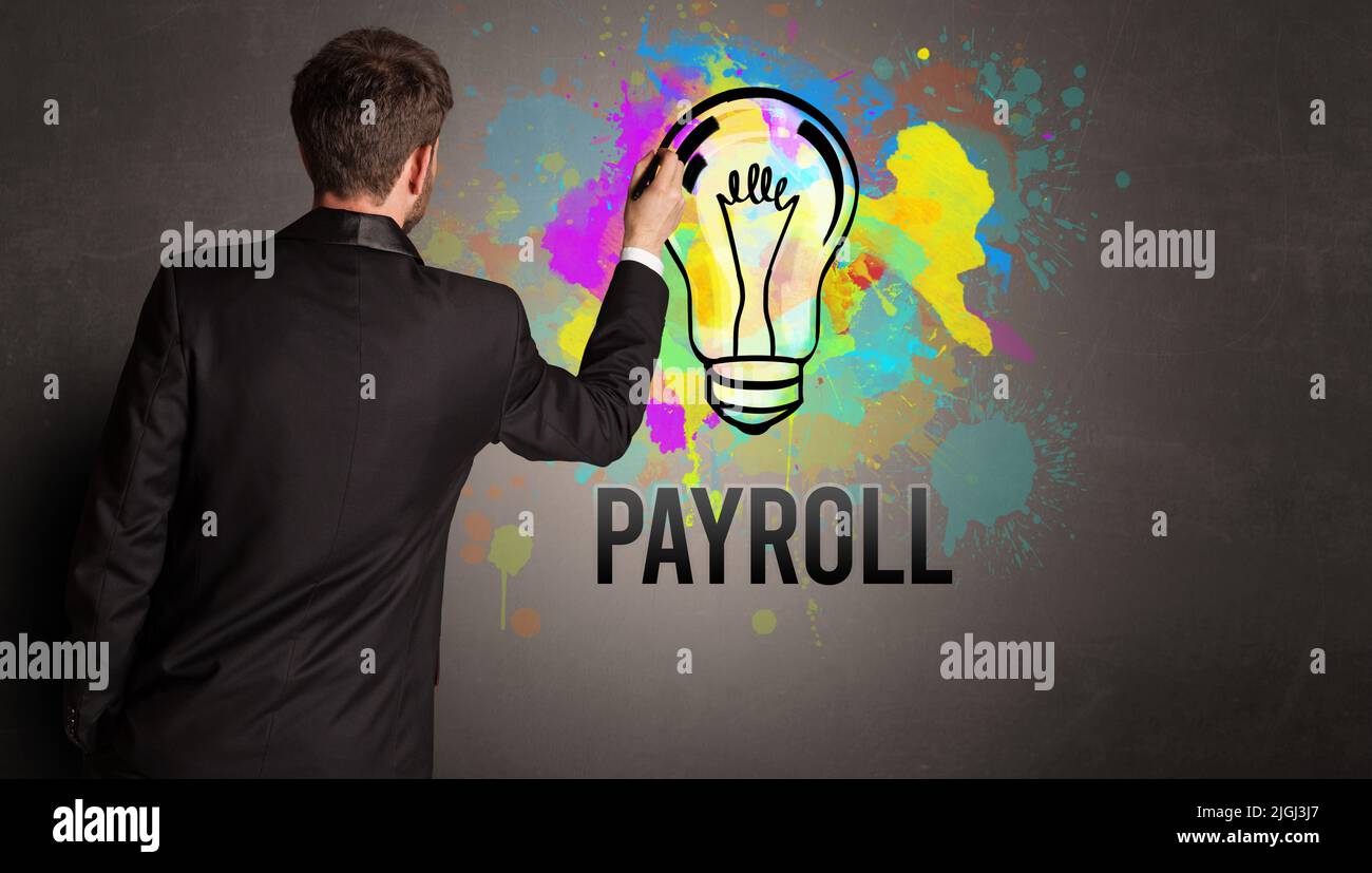 businessman drawing colorful light bulb Stock Photo - Alamy