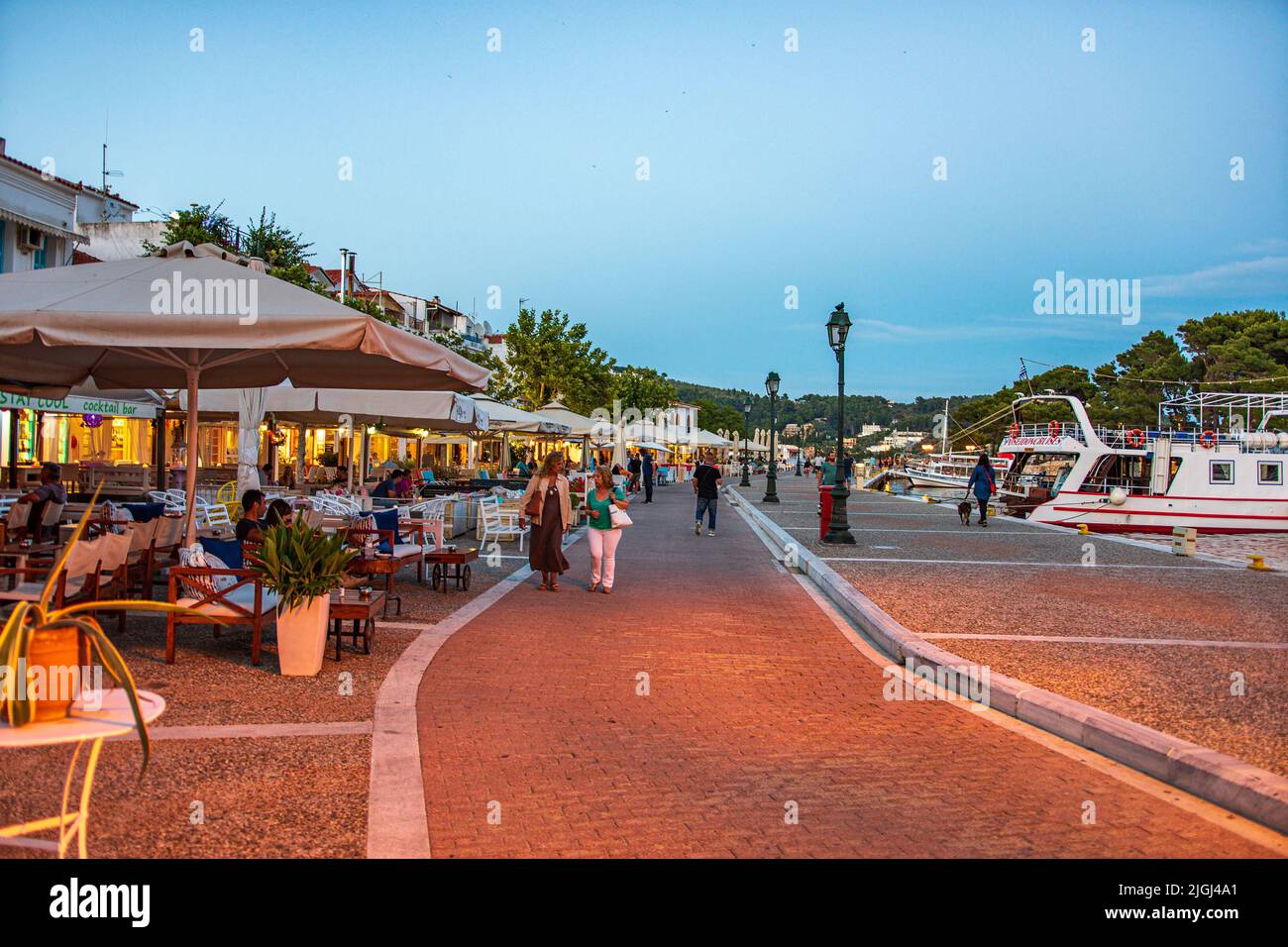 Beautiful seaside view near Skiathos port at sunset. Skiathos, Sporades ...