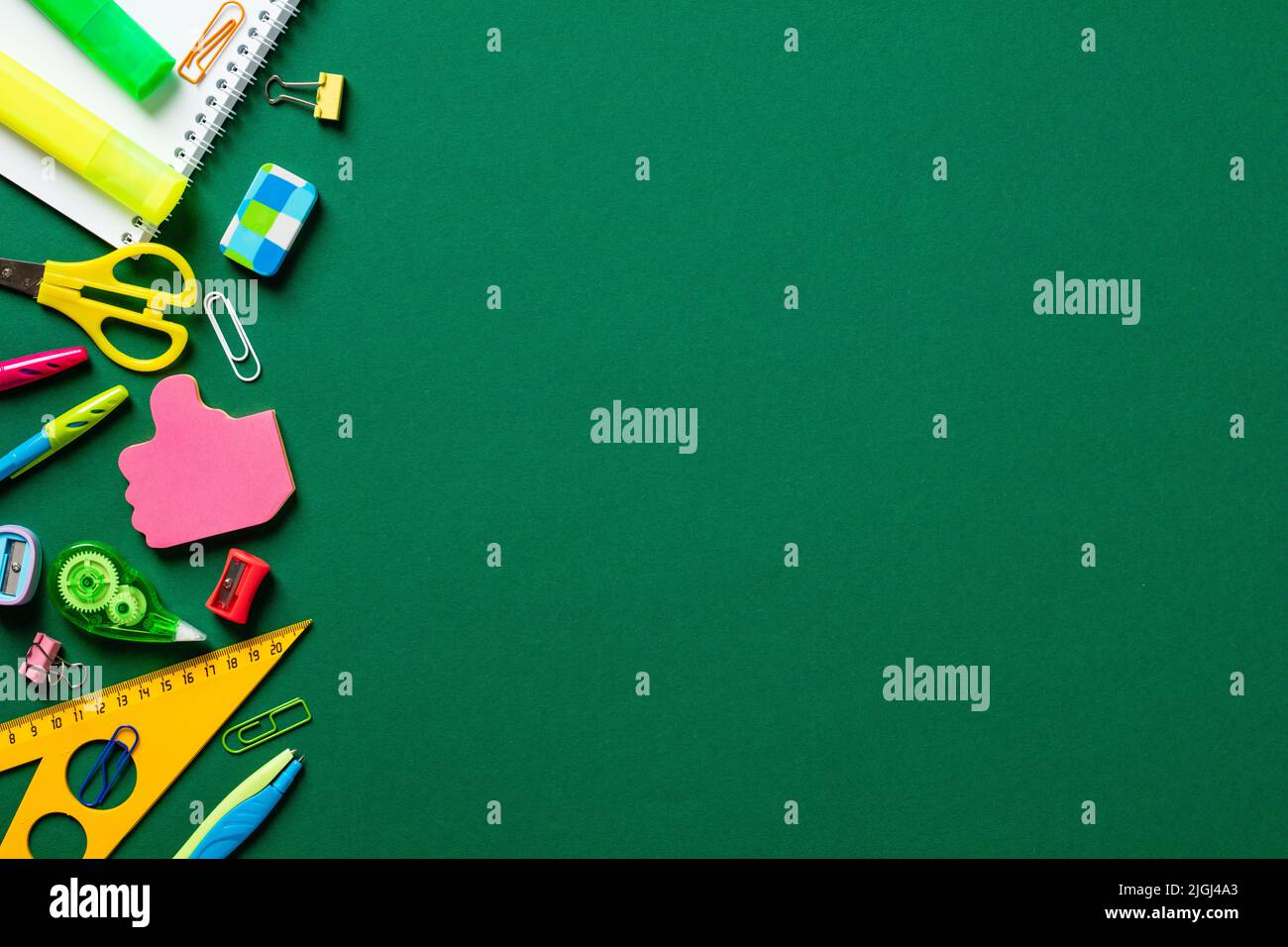 Back to school concept. Flat lay colorful school stationery on green ...