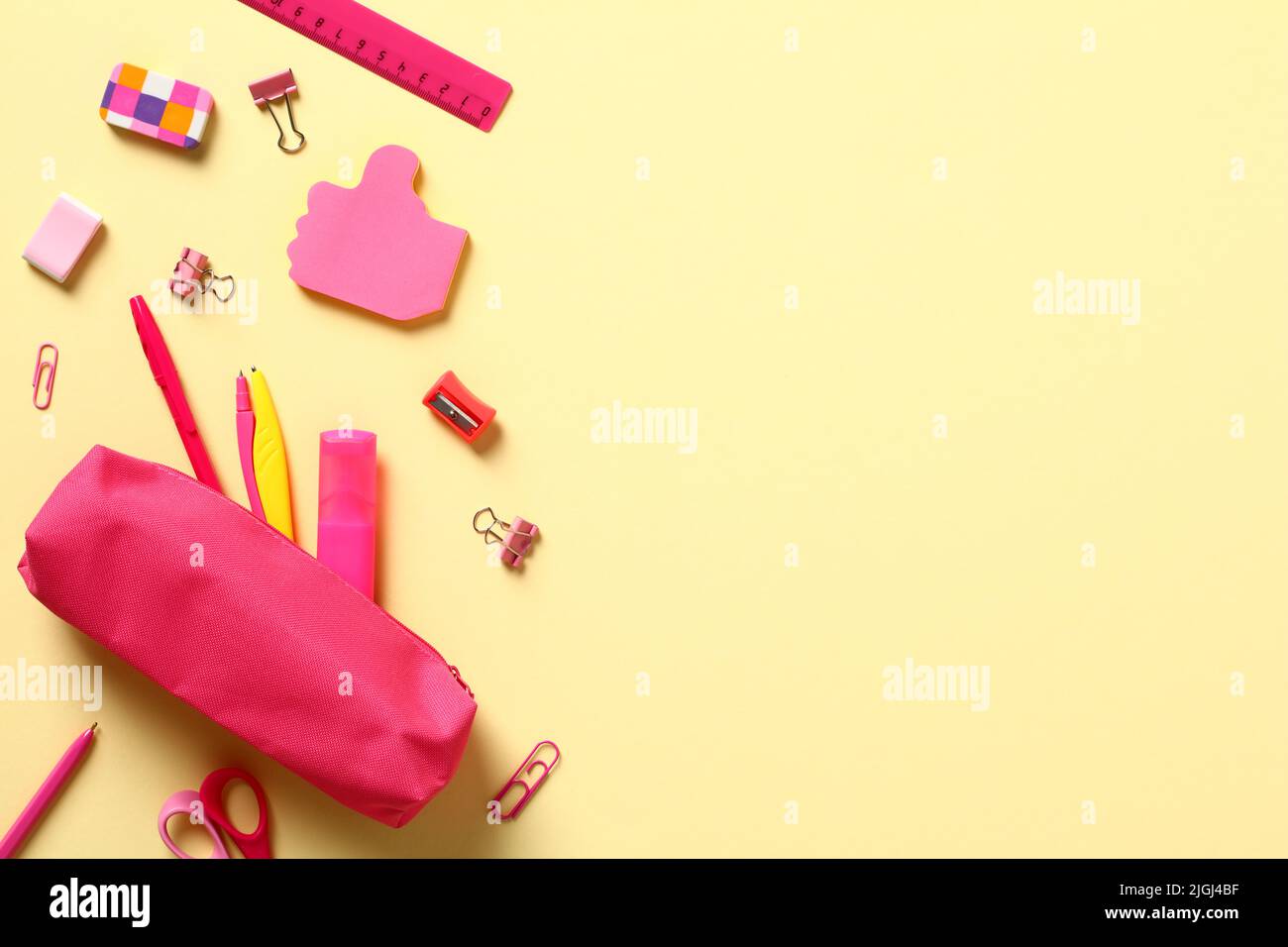 Back to school concept. Flat lay pink school supplies and pencil box on ...