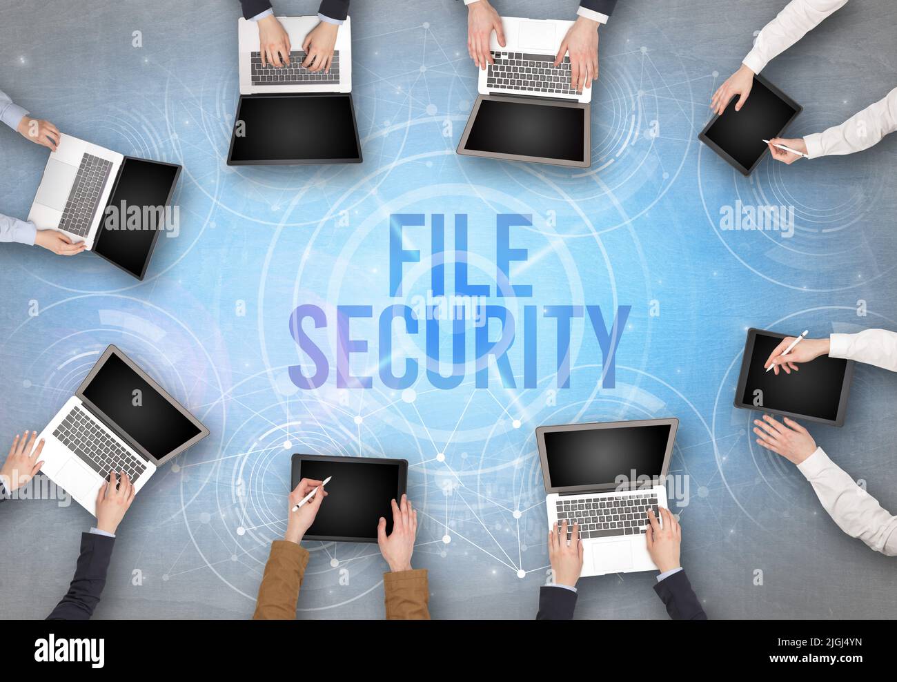 Group of people in front of a laptop, security concept Stock Photo - Alamy