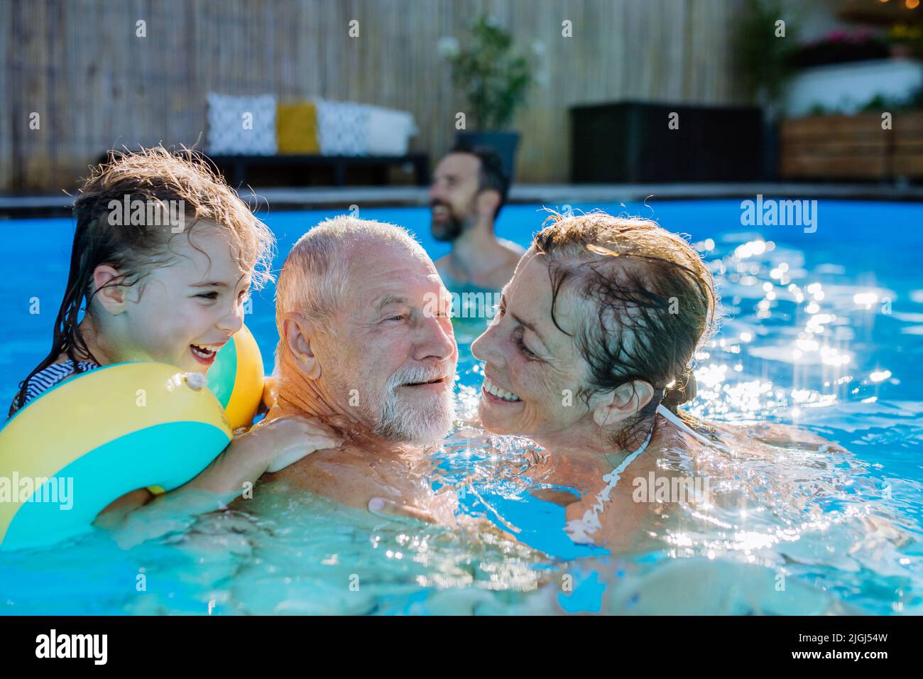 Family enjoying swimming hi-res stock photography and images - Alamy