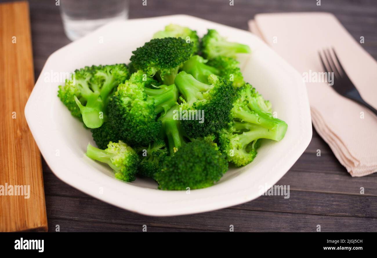 Steamed broccoli, white background hi-res stock photography and images ...