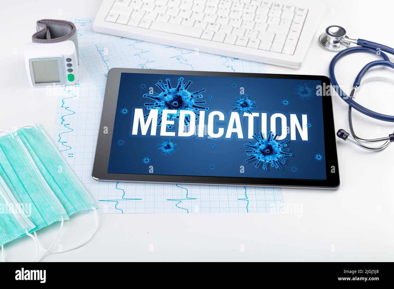 Tablet pc and doctor tools on white surface Stock Photo - Alamy