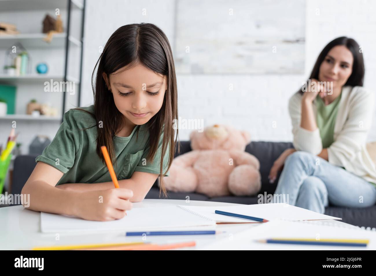 Smiling nanny girl drawing hi-res stock photography and images - Alamy