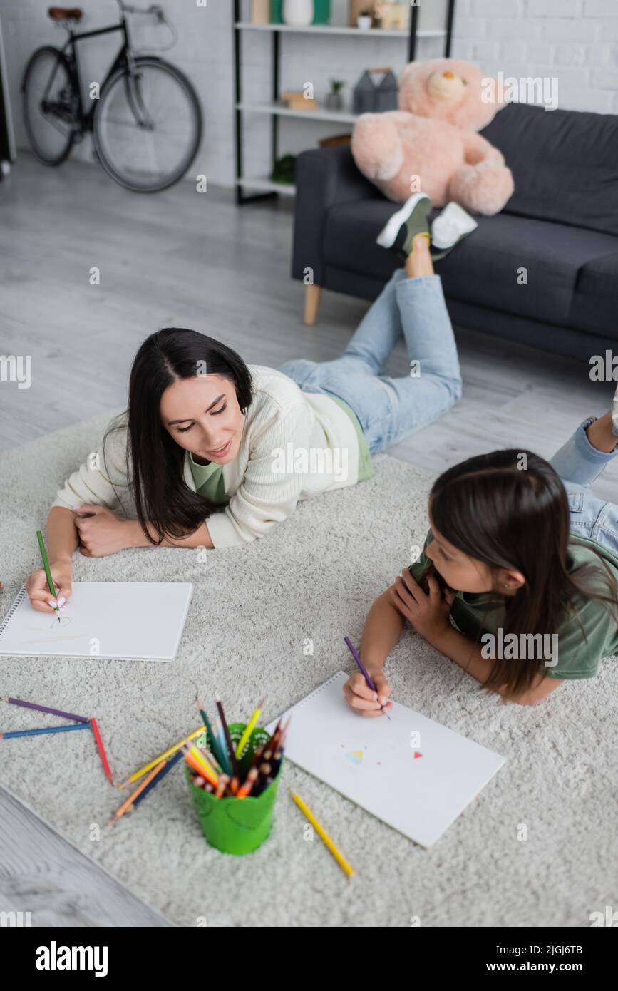 Smiling nanny girl drawing hi-res stock photography and images - Alamy
